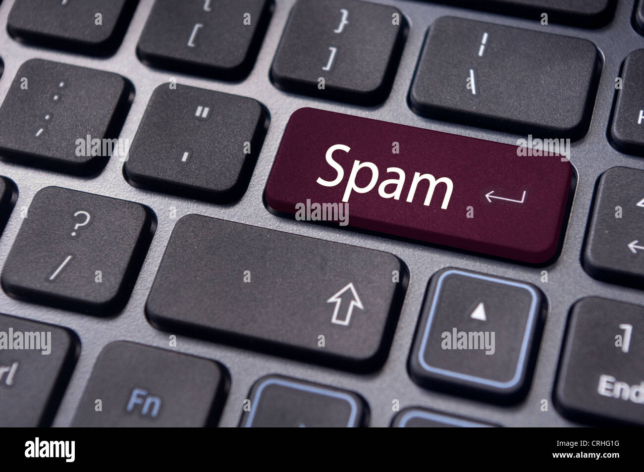 spam email concepts, with message on enter key of computer keyboard ...