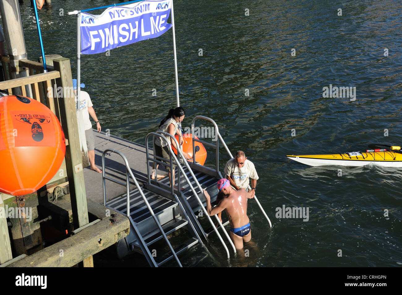 A swimmer at the finish line of the Manhattan Island Marathon Swim, a ...