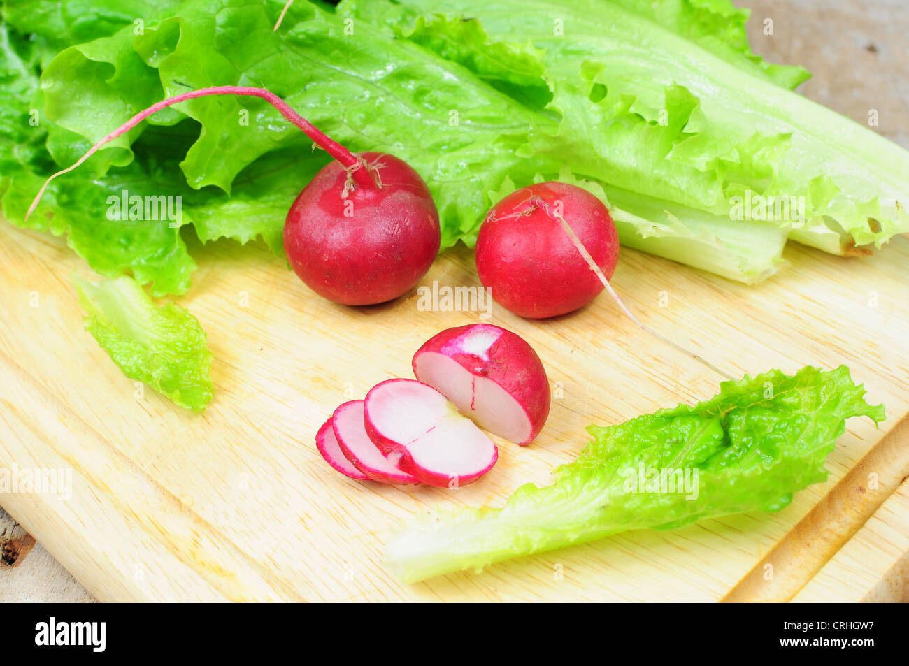 Closeup of lettuce and radish on white background Stock Photo - Alamy
