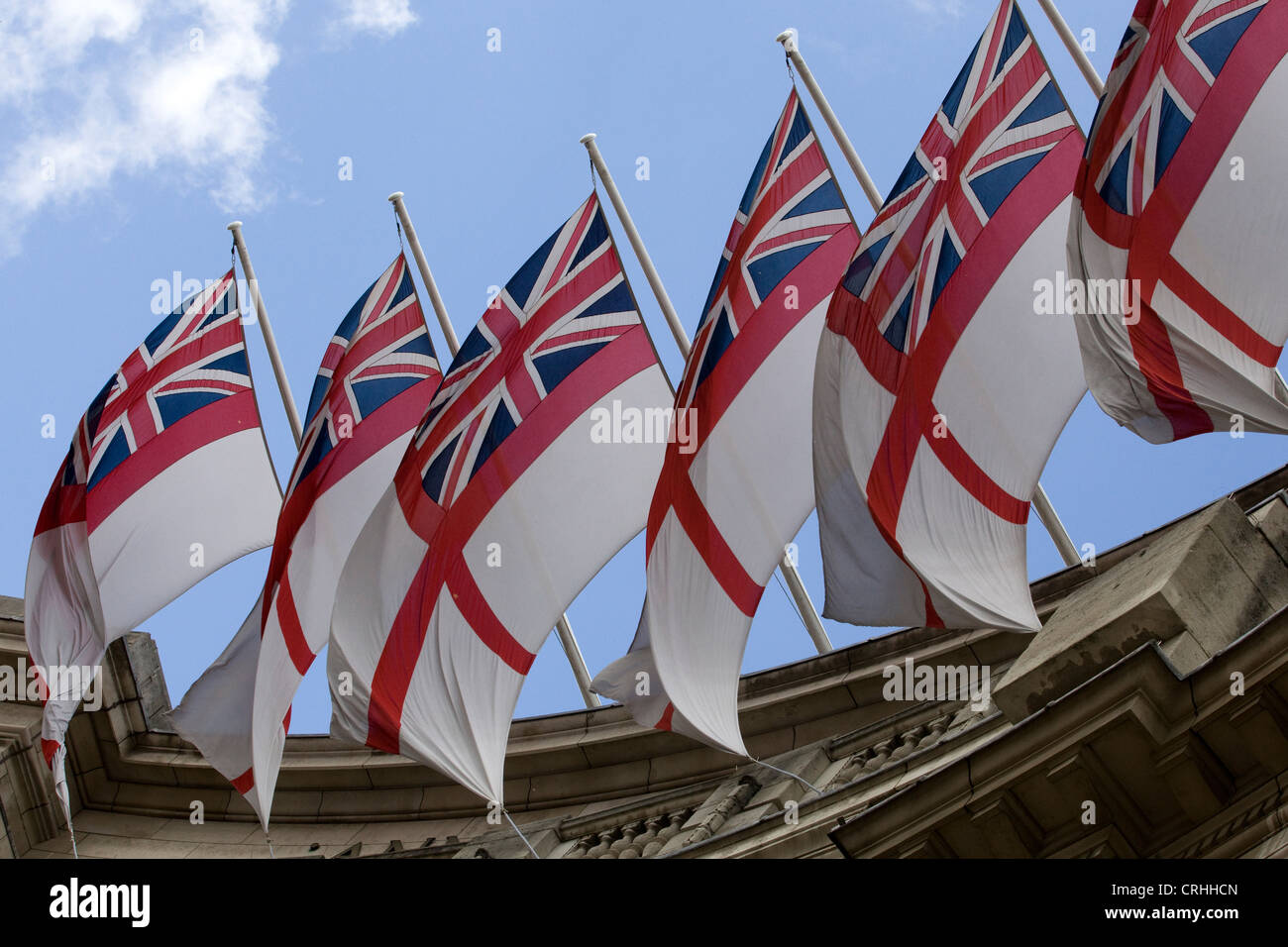 White Ensign Royal Navy maritime flags flying from Admiralty Arch in ...