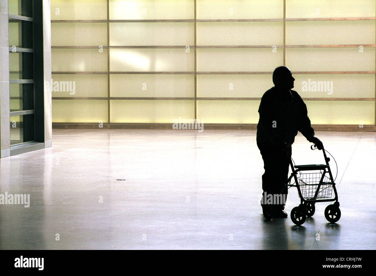 Silhouette of a handicapped old man Stock Photo - Alamy