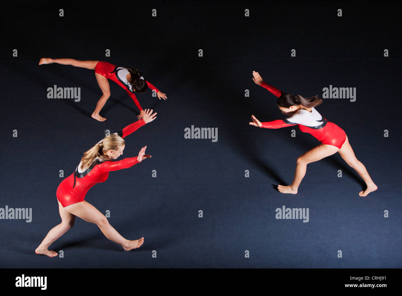 Female gymnasts practicing floor routine Stock Photo - Alamy