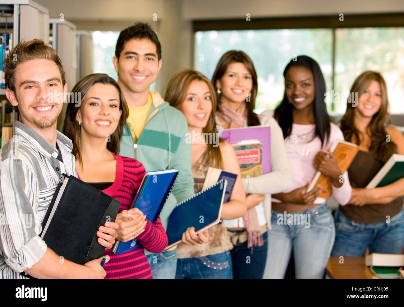 Group of smiling students with notebooks hi-res stock photography and ...