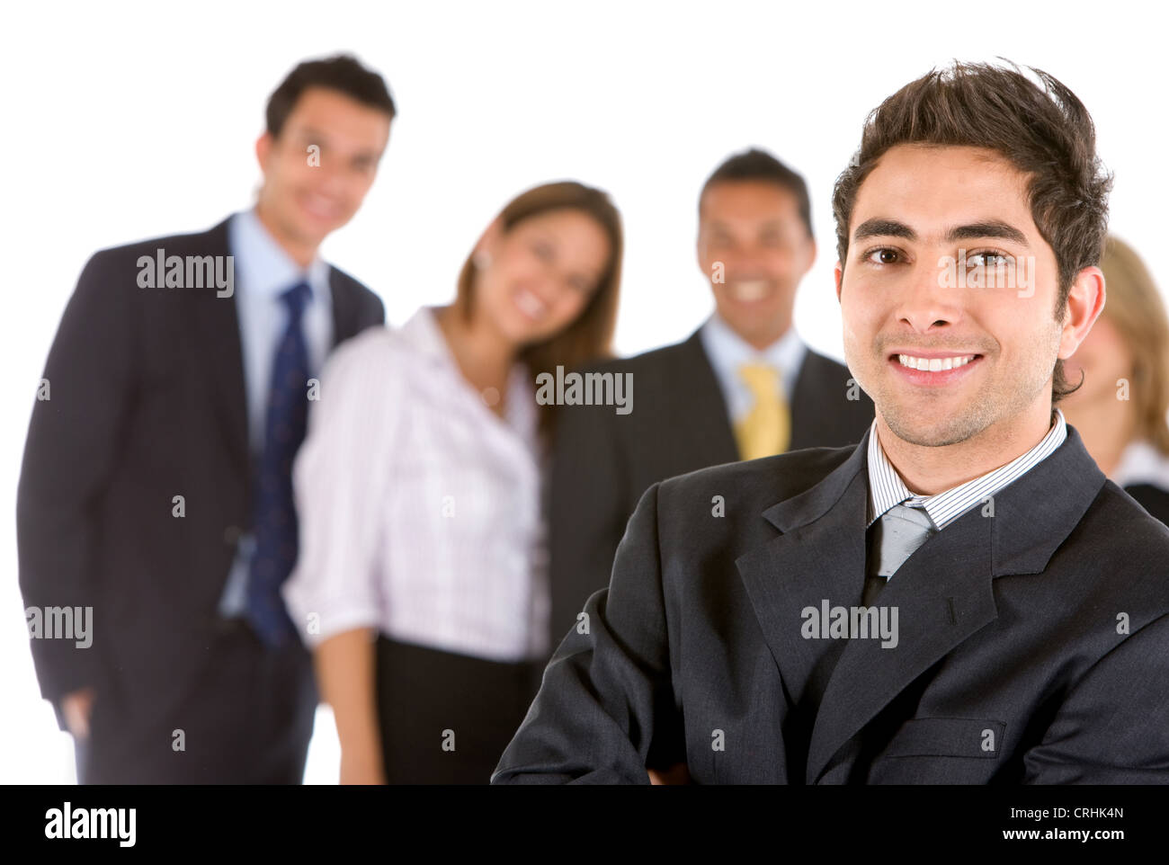 young smiling businessman standing in front of his team Stock Photo - Alamy