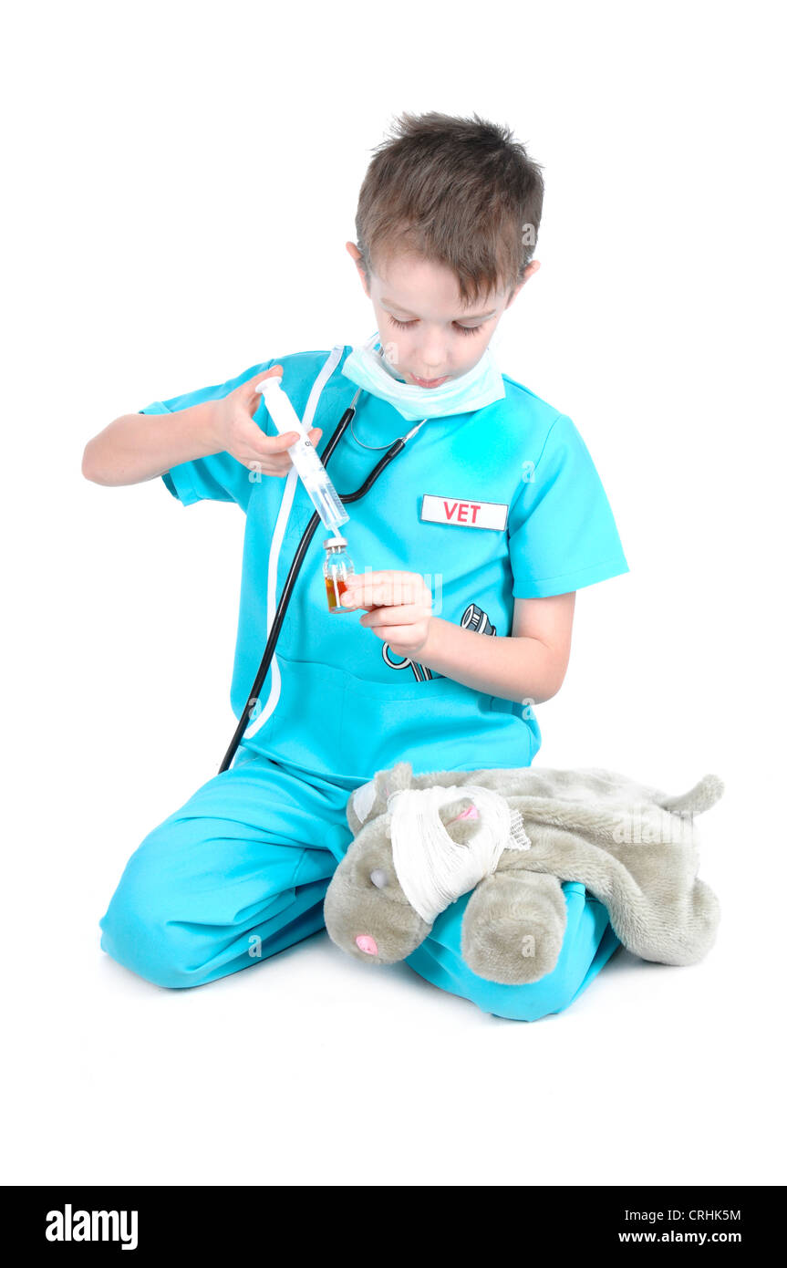 Boy playing the veterinary surgeon Stock Photo - Alamy
