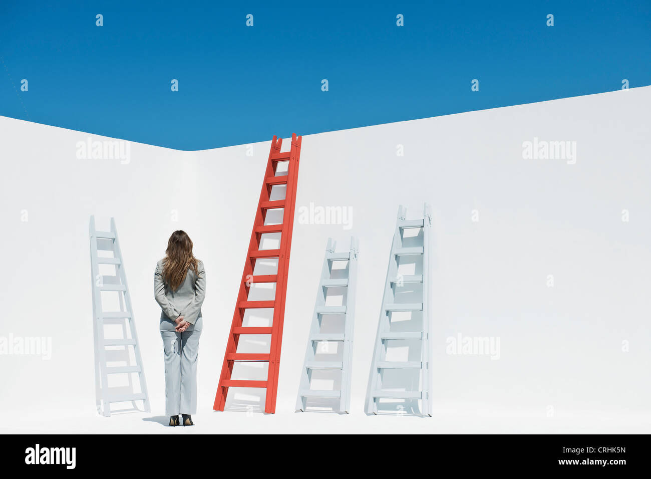 Woman climbing ladder from behind hi-res stock photography and images ...