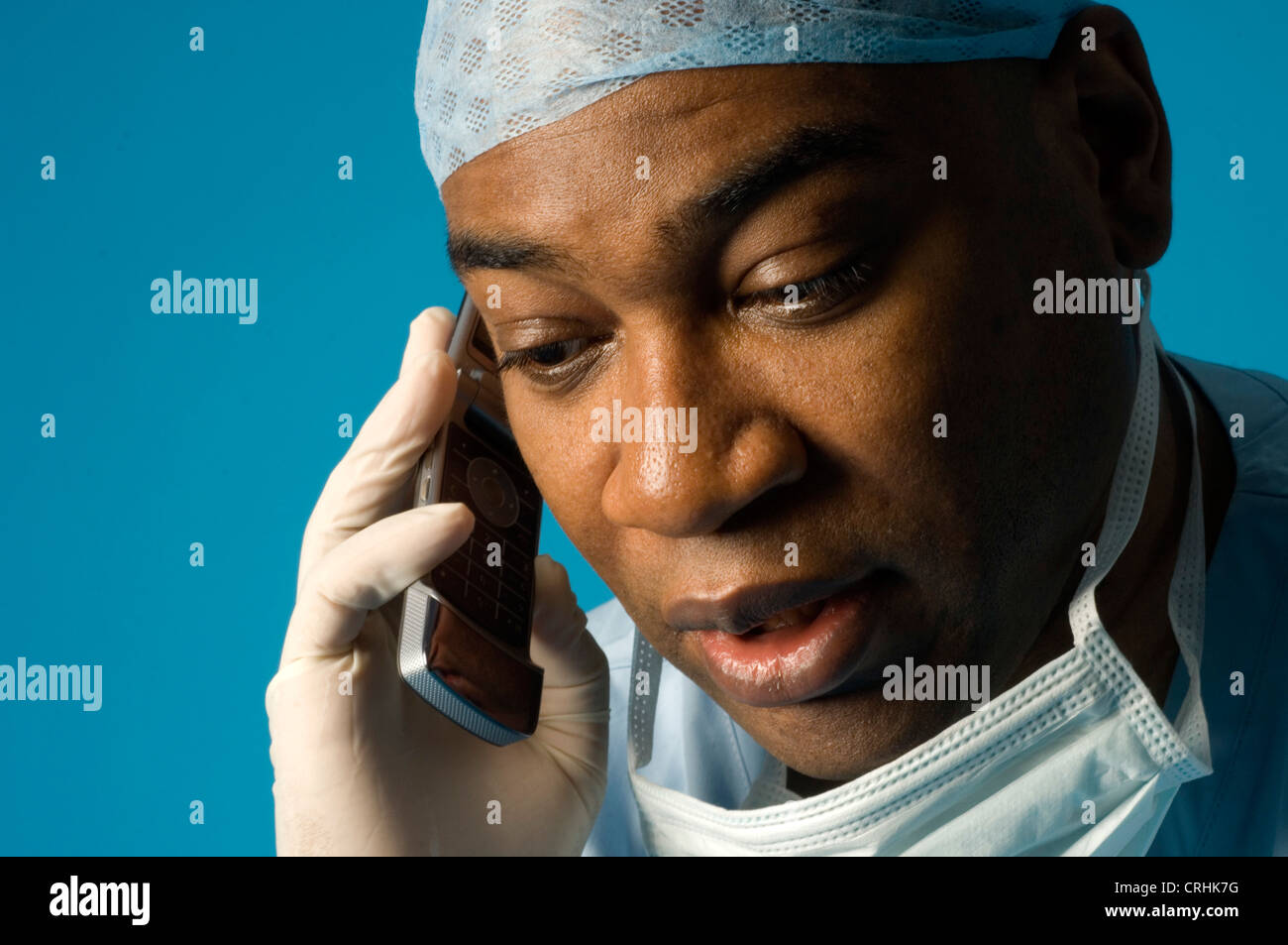 A surgeon talks on his mobile phone Stock Photo - Alamy