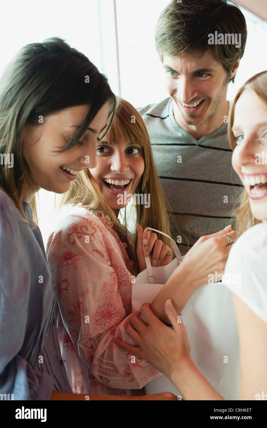 Friends laughing together Stock Photo - Alamy