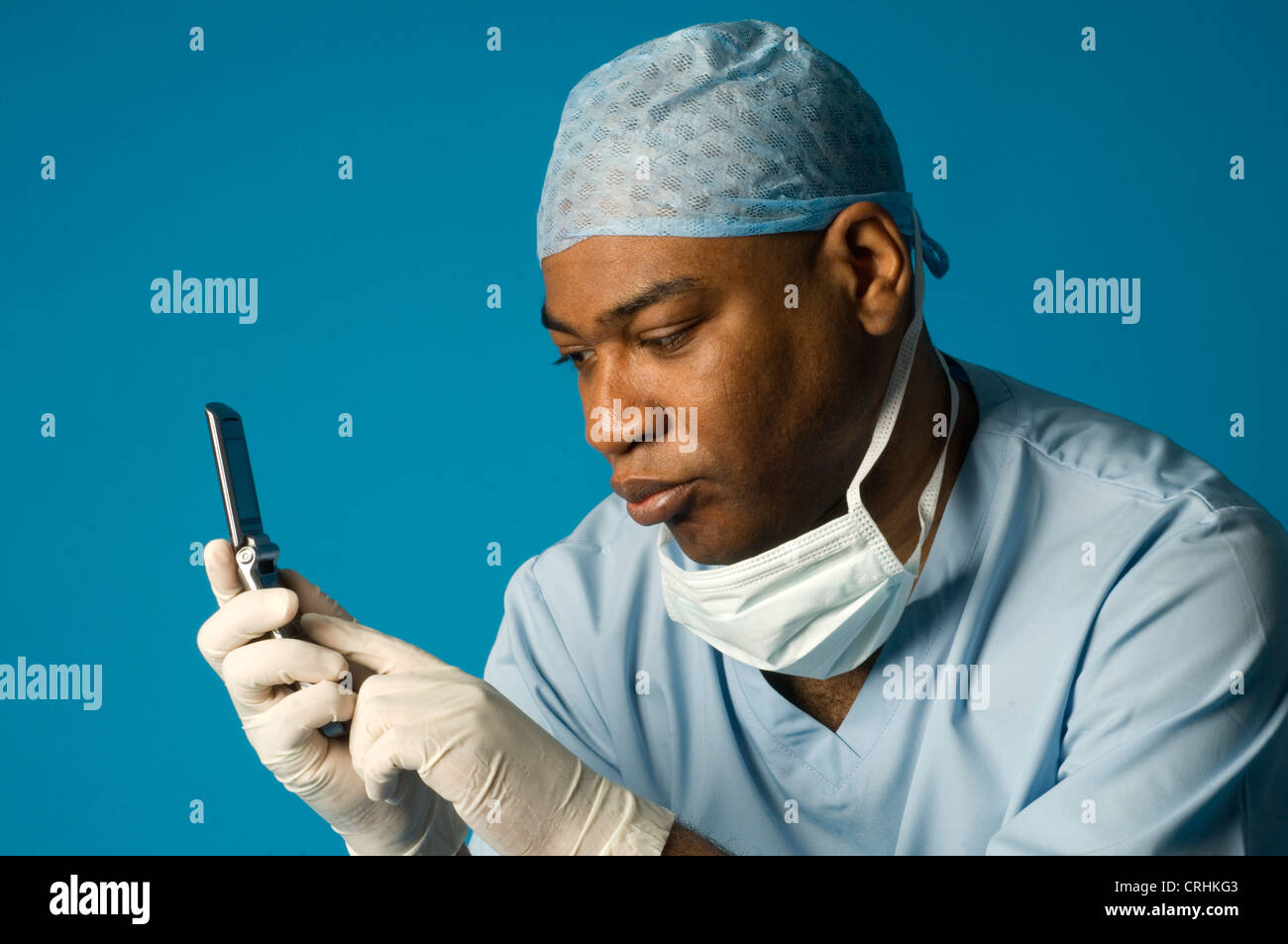 Surgeon using mobile phone Stock Photo - Alamy