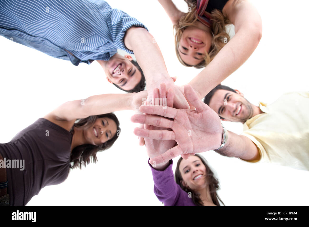 Happy group of friends with their hands together in the middle Stock ...