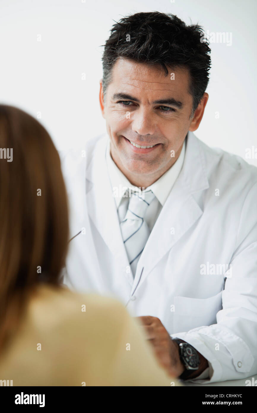Doctor meeting with patient for consultation Stock Photo - Alamy