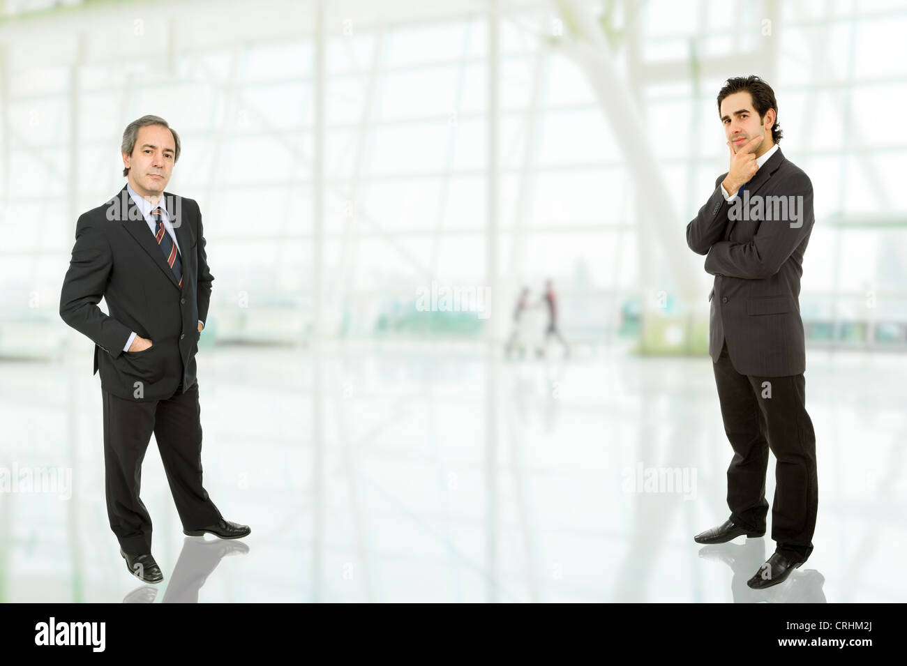 two business men standing at the office Stock Photo - Alamy