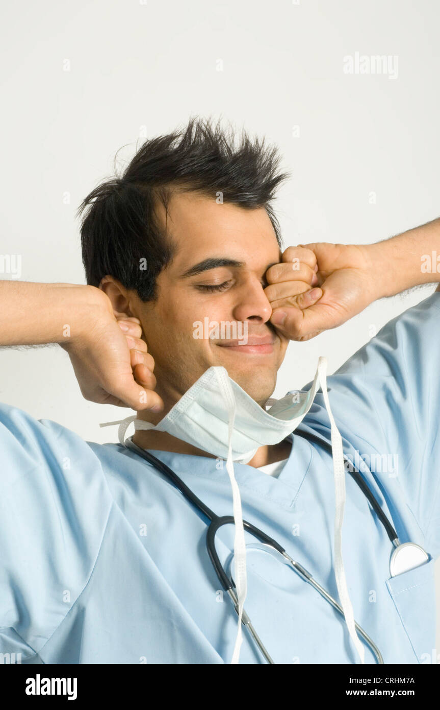 Tired surgeon stretching Stock Photo - Alamy