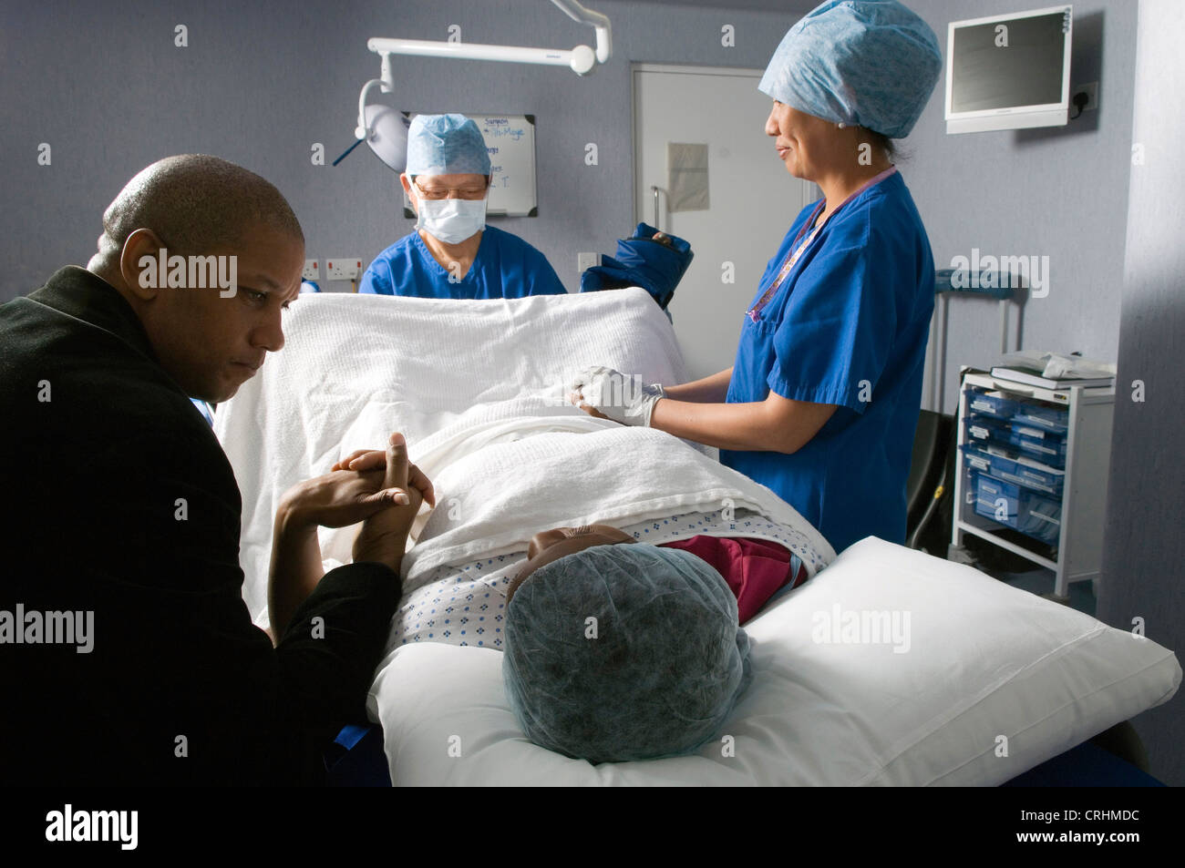 couple during IVF treatment with doctor and nurse in background Stock ...