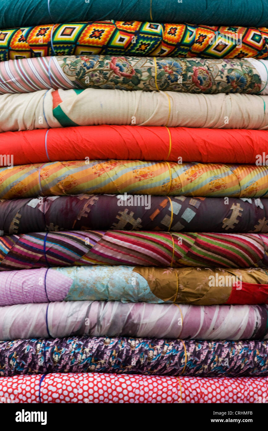 A towering baobab tree made from colorful strands of recycled textiles ...