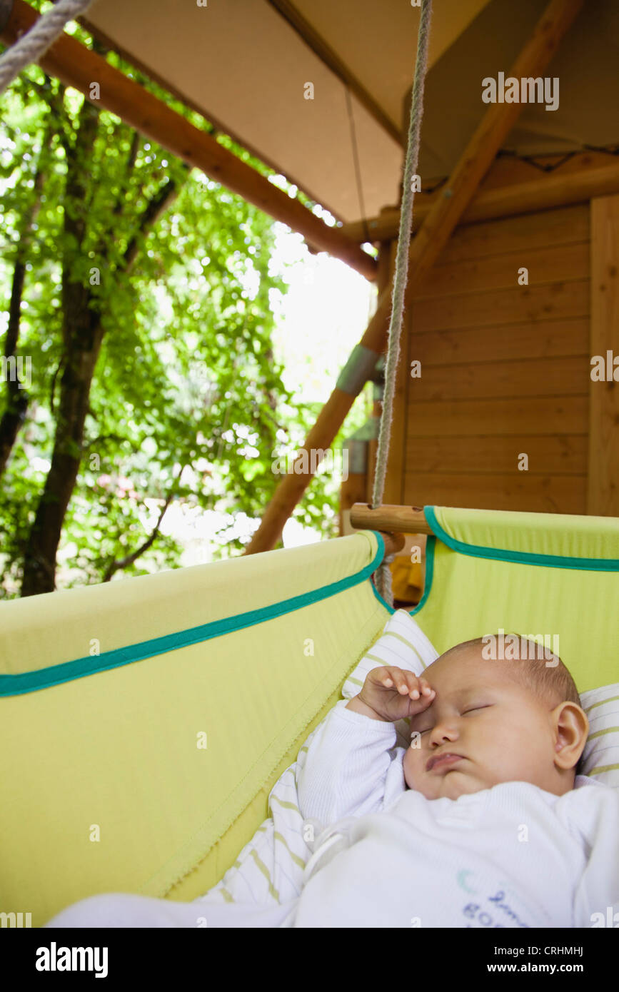 Baby napping in cradle outdoors Stock Photo - Alamy