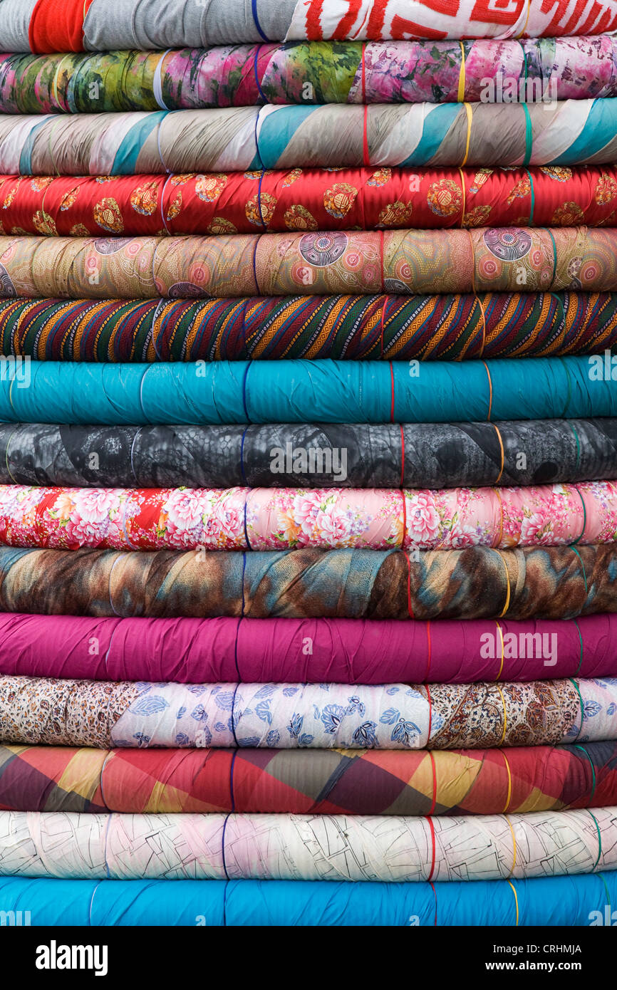 A towering baobab tree made from colorful strands of recycled textiles ...