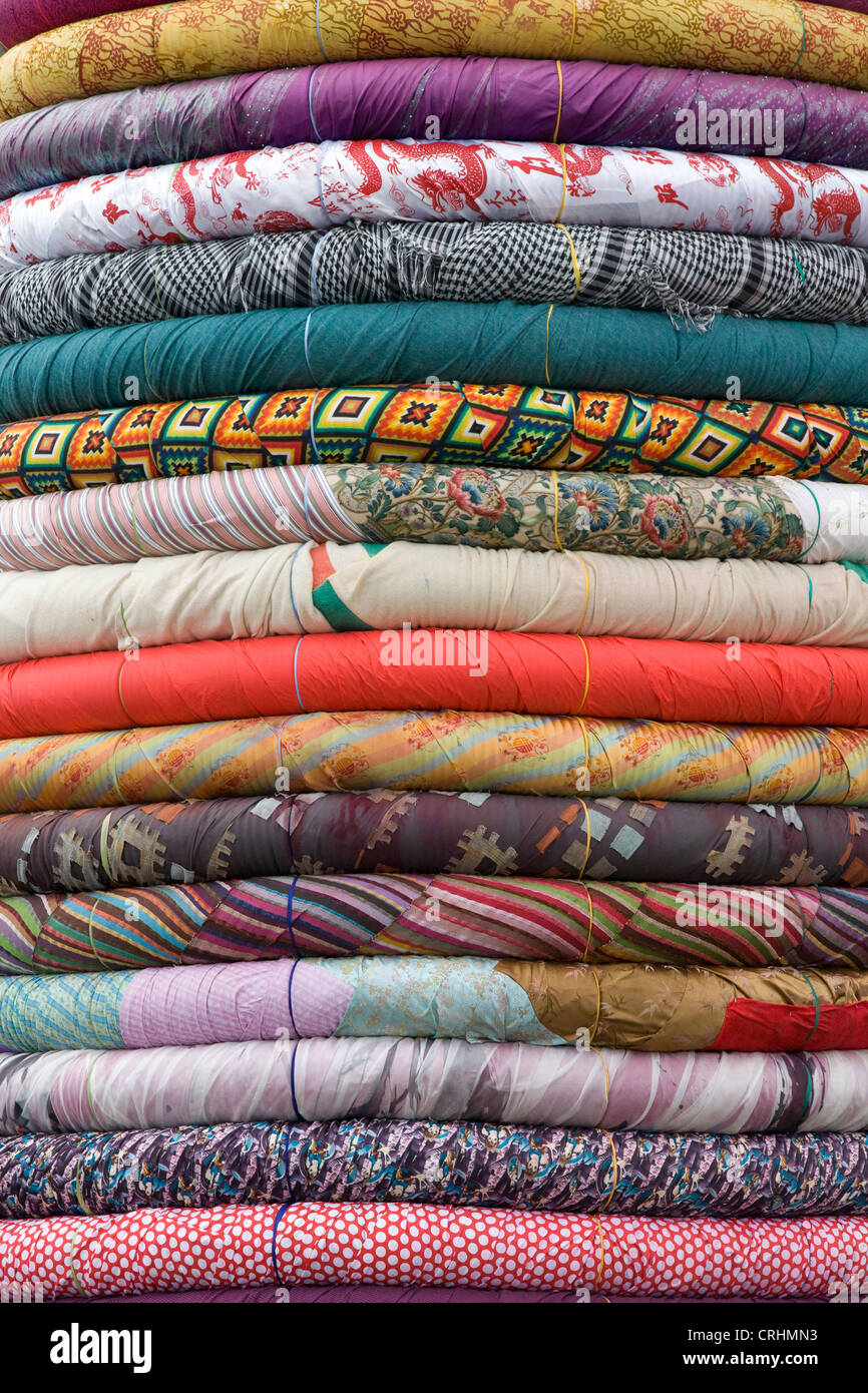 A towering baobab tree made from colorful strands of recycled textiles ...