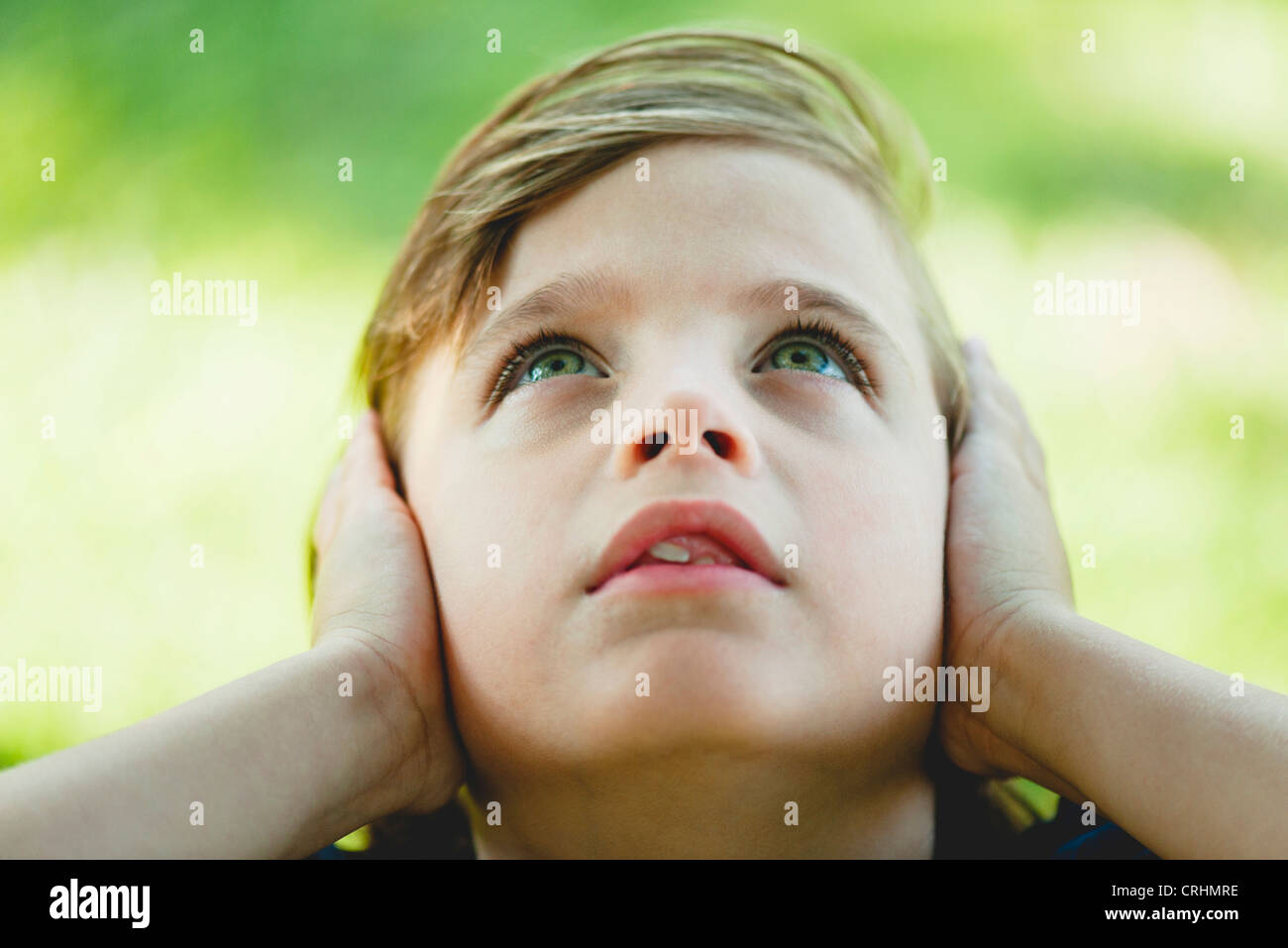 Child covering their ears hi-res stock photography and images - Alamy
