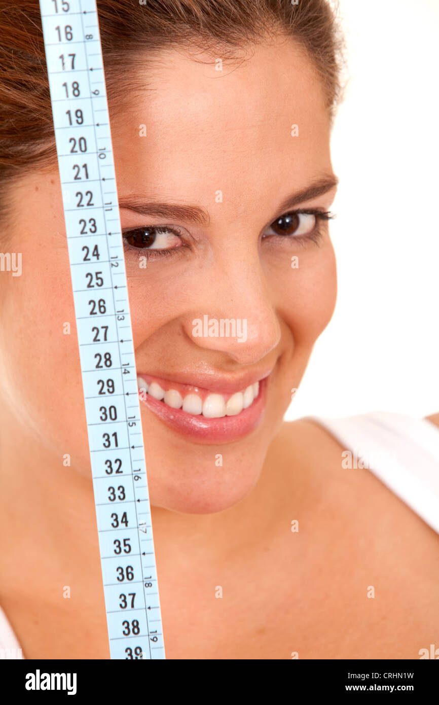 woman with a measuring tape Stock Photo - Alamy