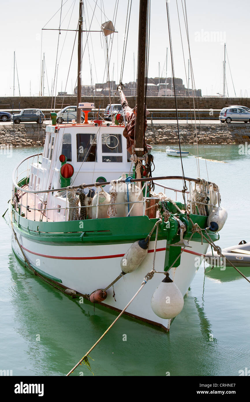 Sailing boat tied up Guernsey Harbour St Peters Port Channel Islands UK ...