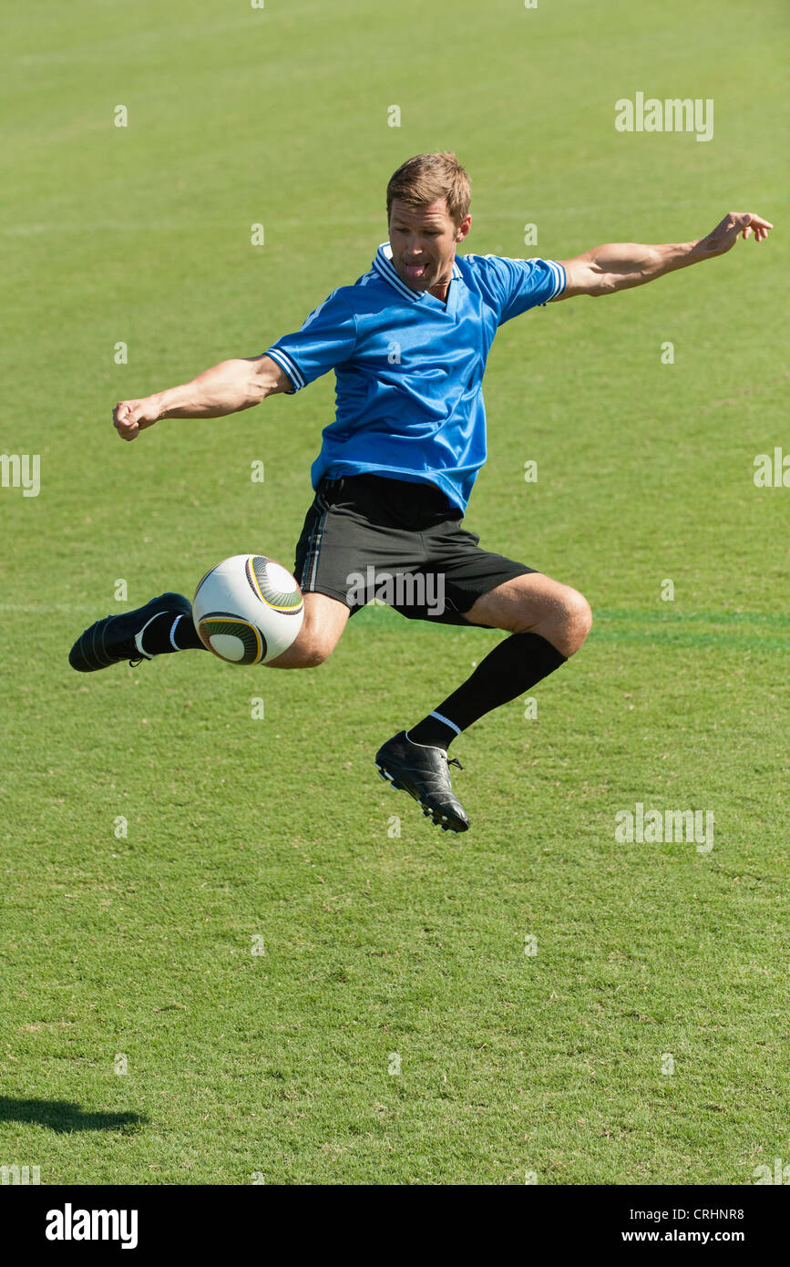 Kicking ball kicking balls hi-res stock photography and images - Alamy