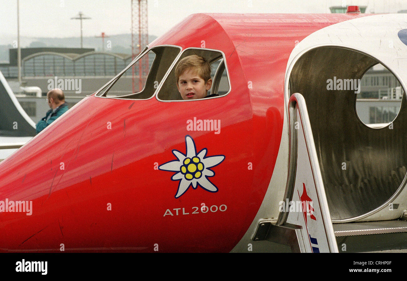 Zurich, Switzerland, as a boy playing in a miniature airplane pilot ...