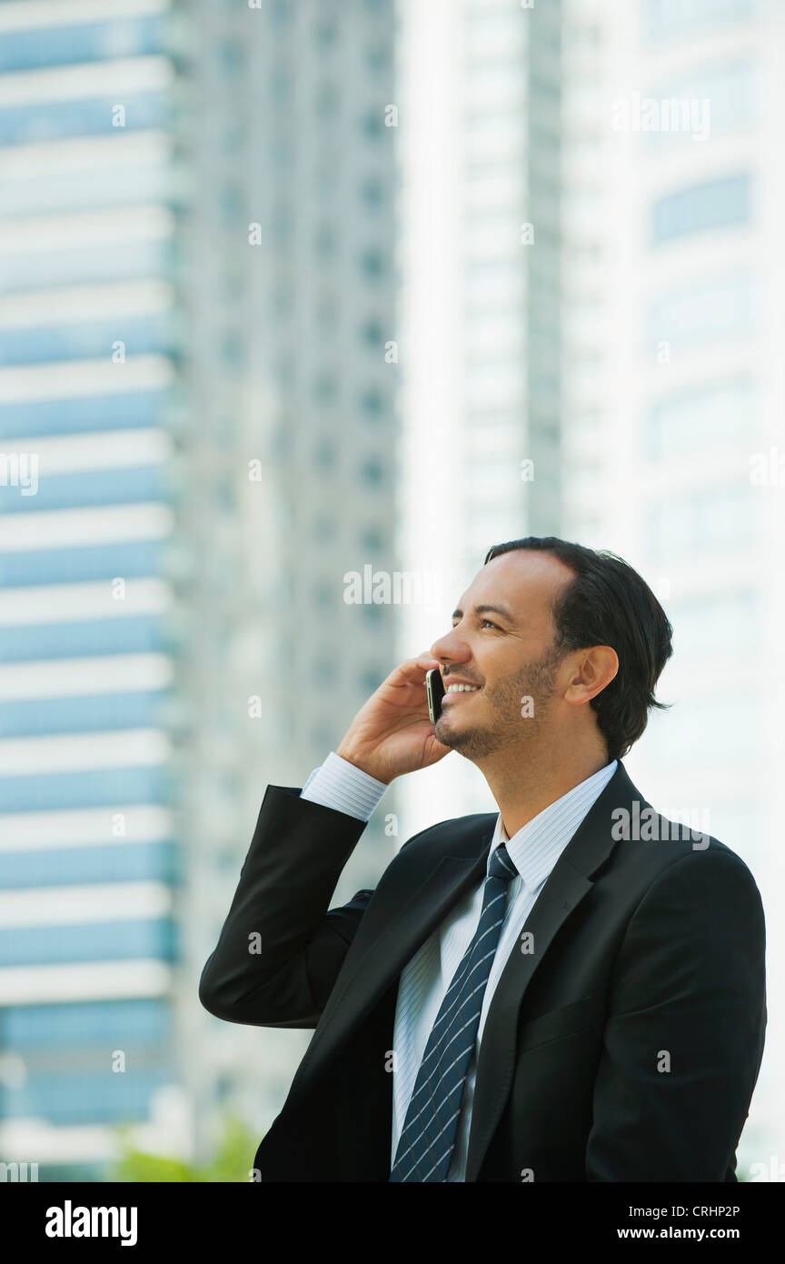 Business executive using cell phone outdoors Stock Photo - Alamy