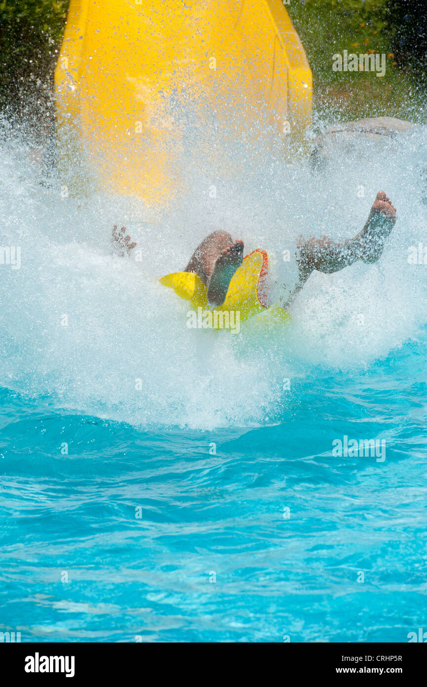 Person having fun in the summer coming down a long water chute Stock ...