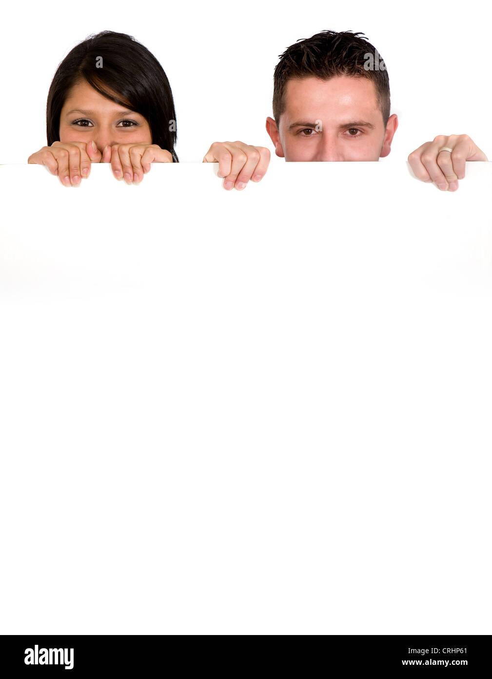 young couple holding a white banner Stock Photo - Alamy