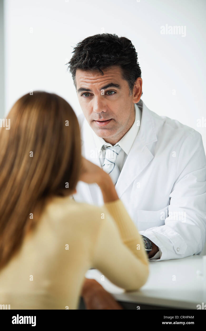 Doctor meeting with patient for consultation Stock Photo - Alamy