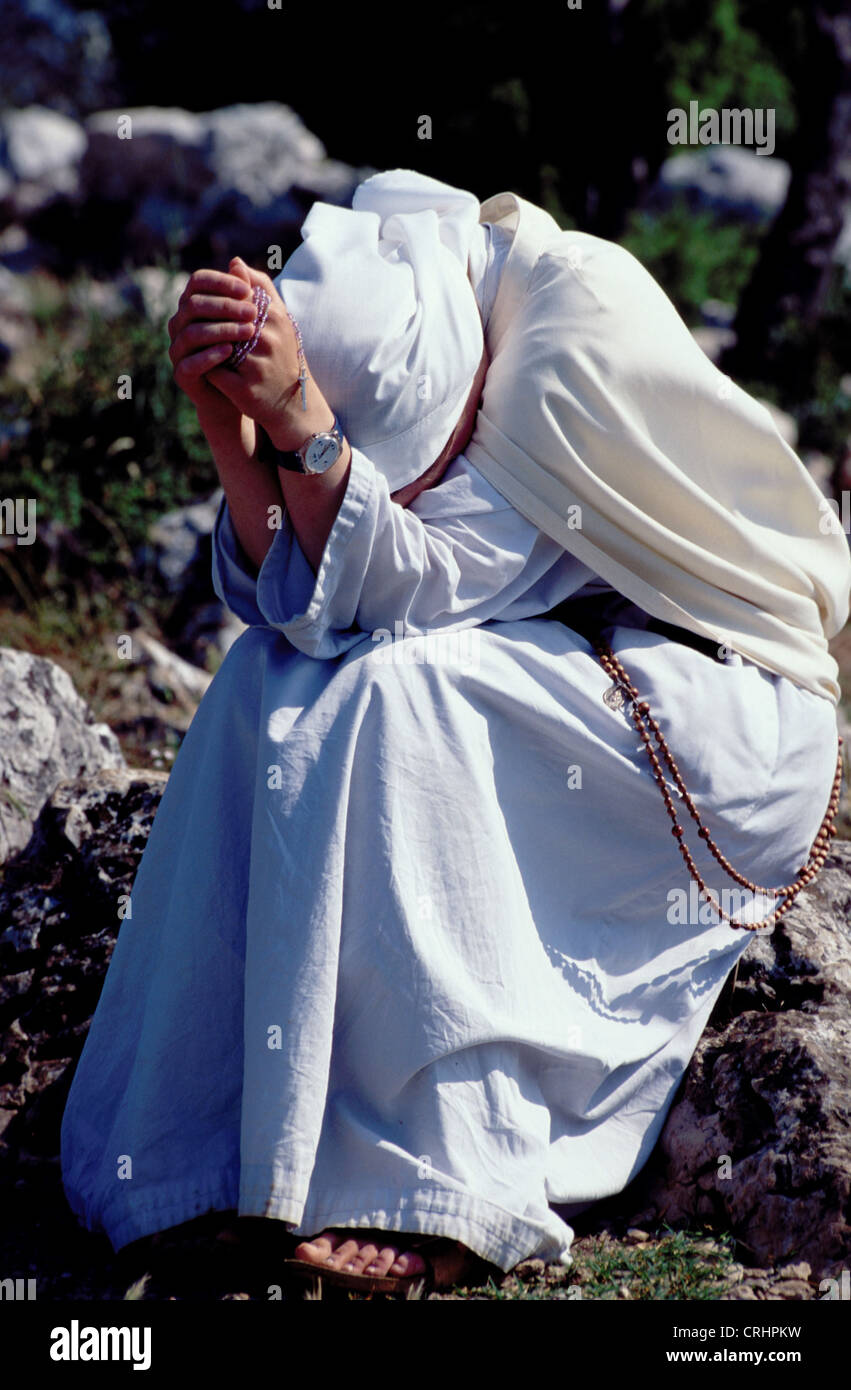 Medjugorje, Bosnia and Herzegovina, praying nun on Apparition Hill ...