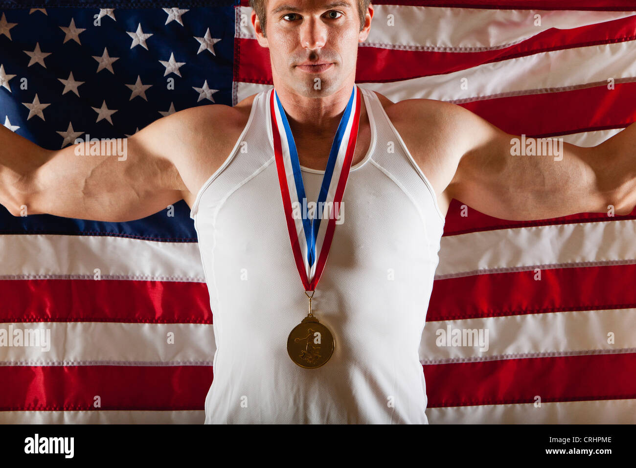 Male medalist in front of American flag Stock Photo - Alamy