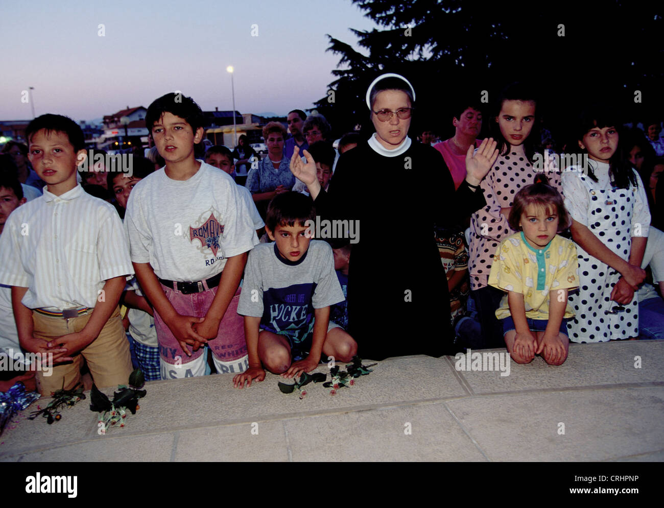 Medjugorje, Bosnia and Herzegovina, a nun with children at the Shrine ...
