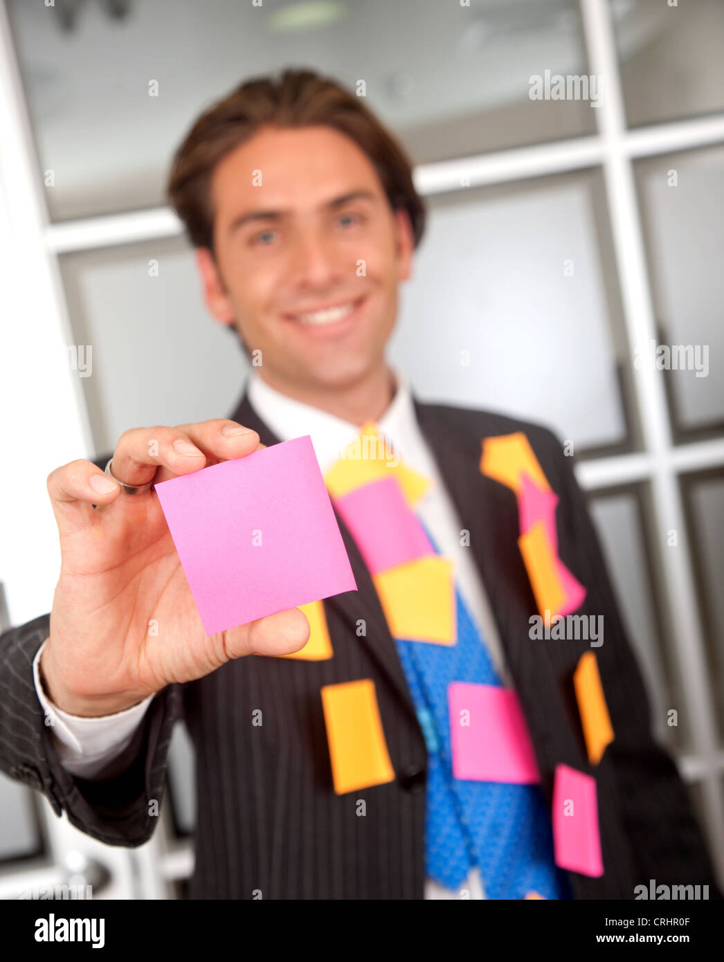businessman covered with post its at an office showing post it Stock ...