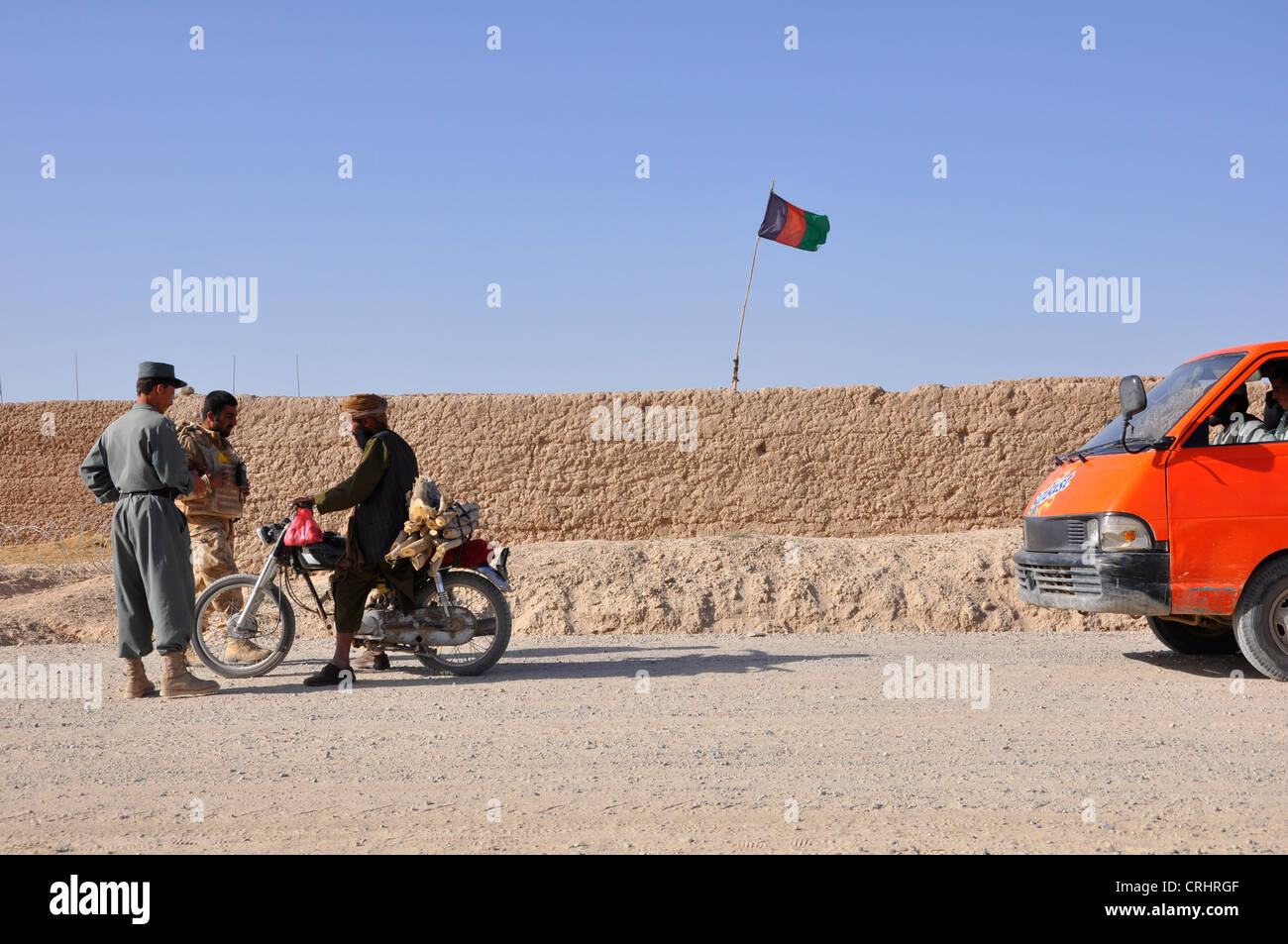policeman stop an afghan civilian at a vehicle checkpoint Stock Photo ...