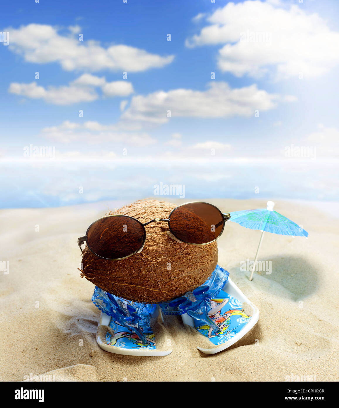 Coconut at beach with glasses and sandals fun concept Stock Photo - Alamy