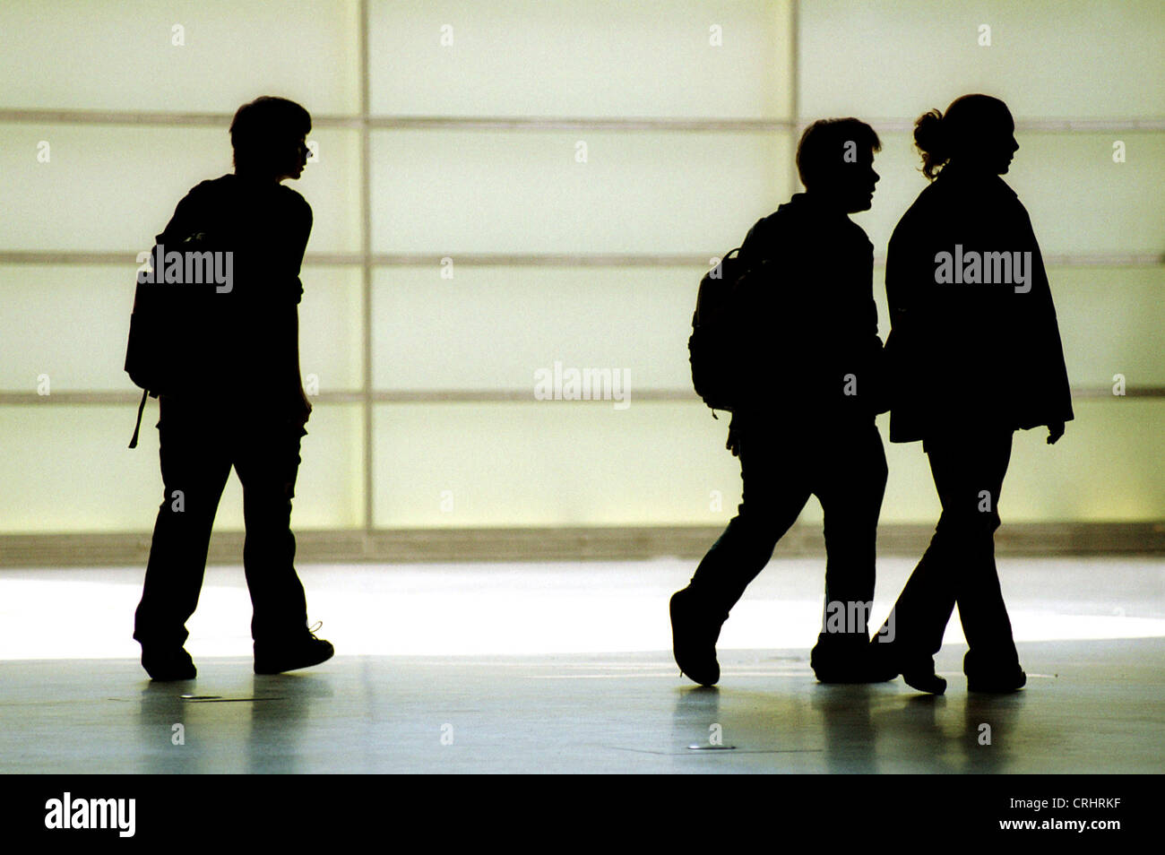 Silhouettes of three pupils Stock Photo - Alamy