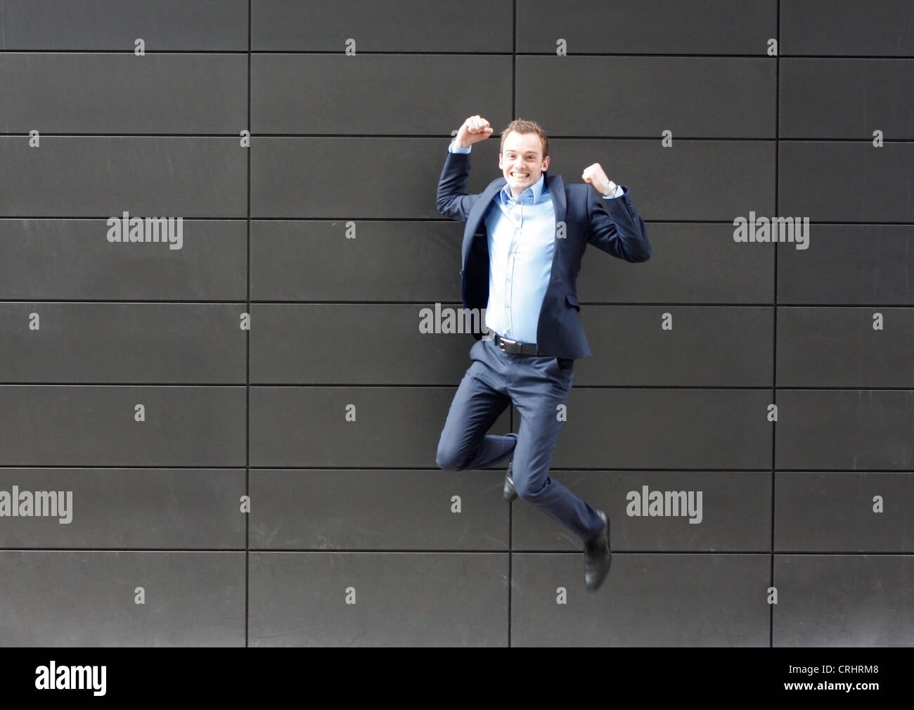 Business man jumping Stock Photo - Alamy