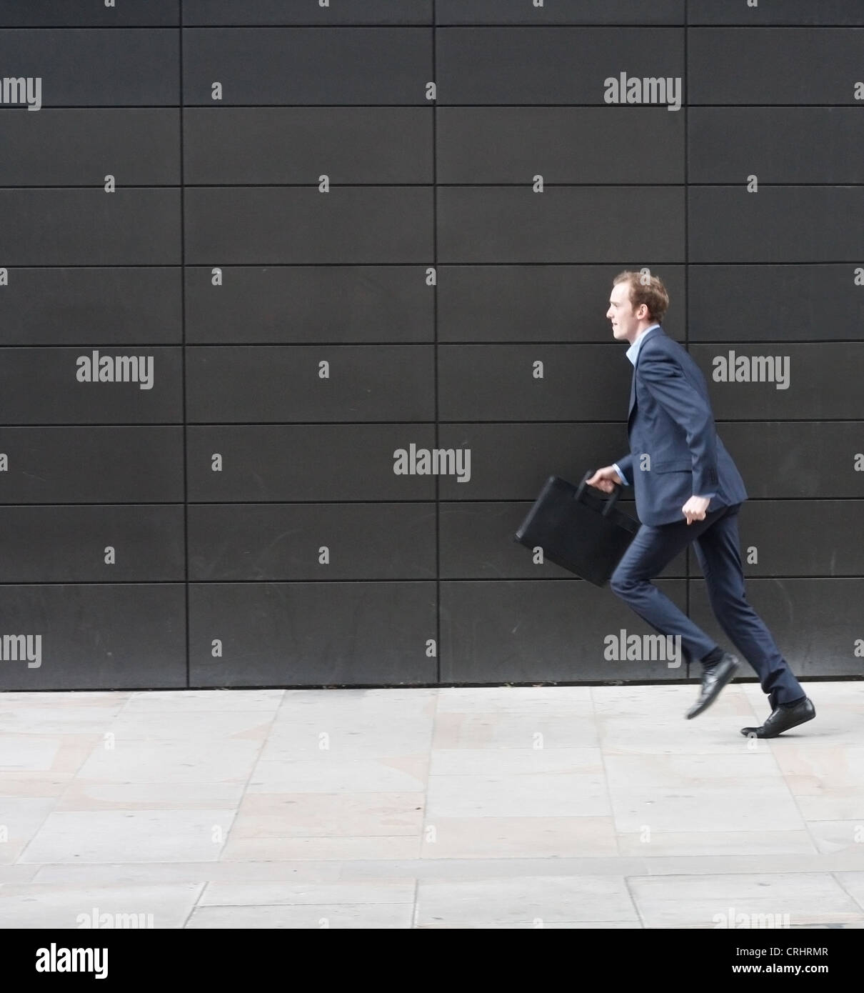 Business man running Stock Photo - Alamy