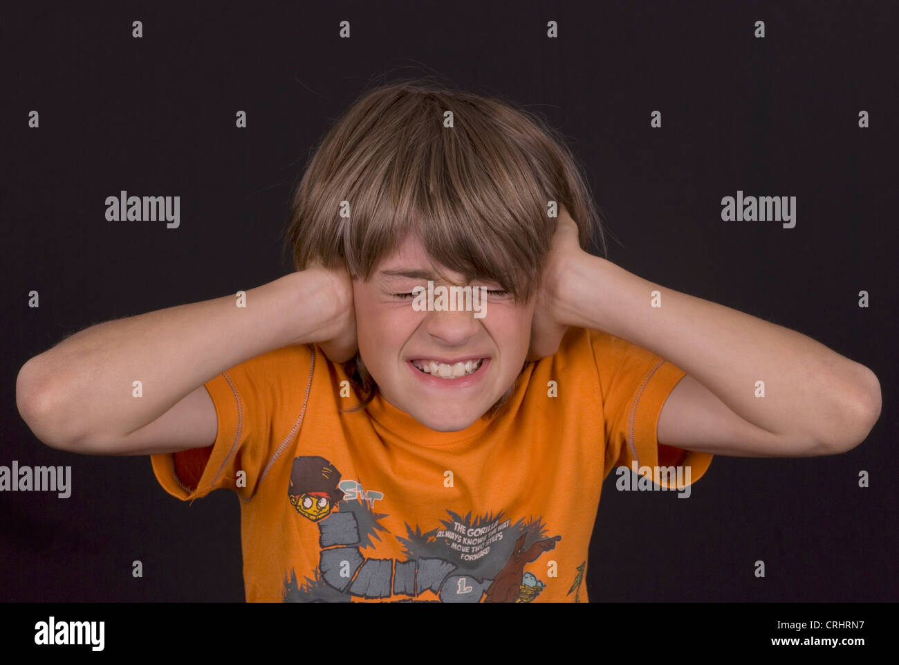 boy keeps shut his ears Stock Photo - Alamy