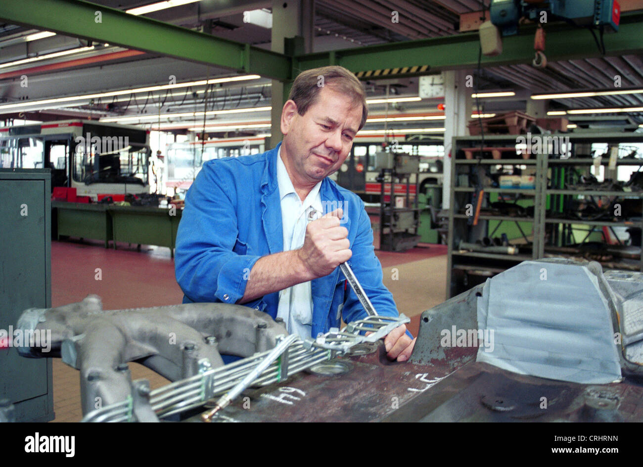 Bochum, Germany, car mechanic repairs engine Stock Photo - Alamy