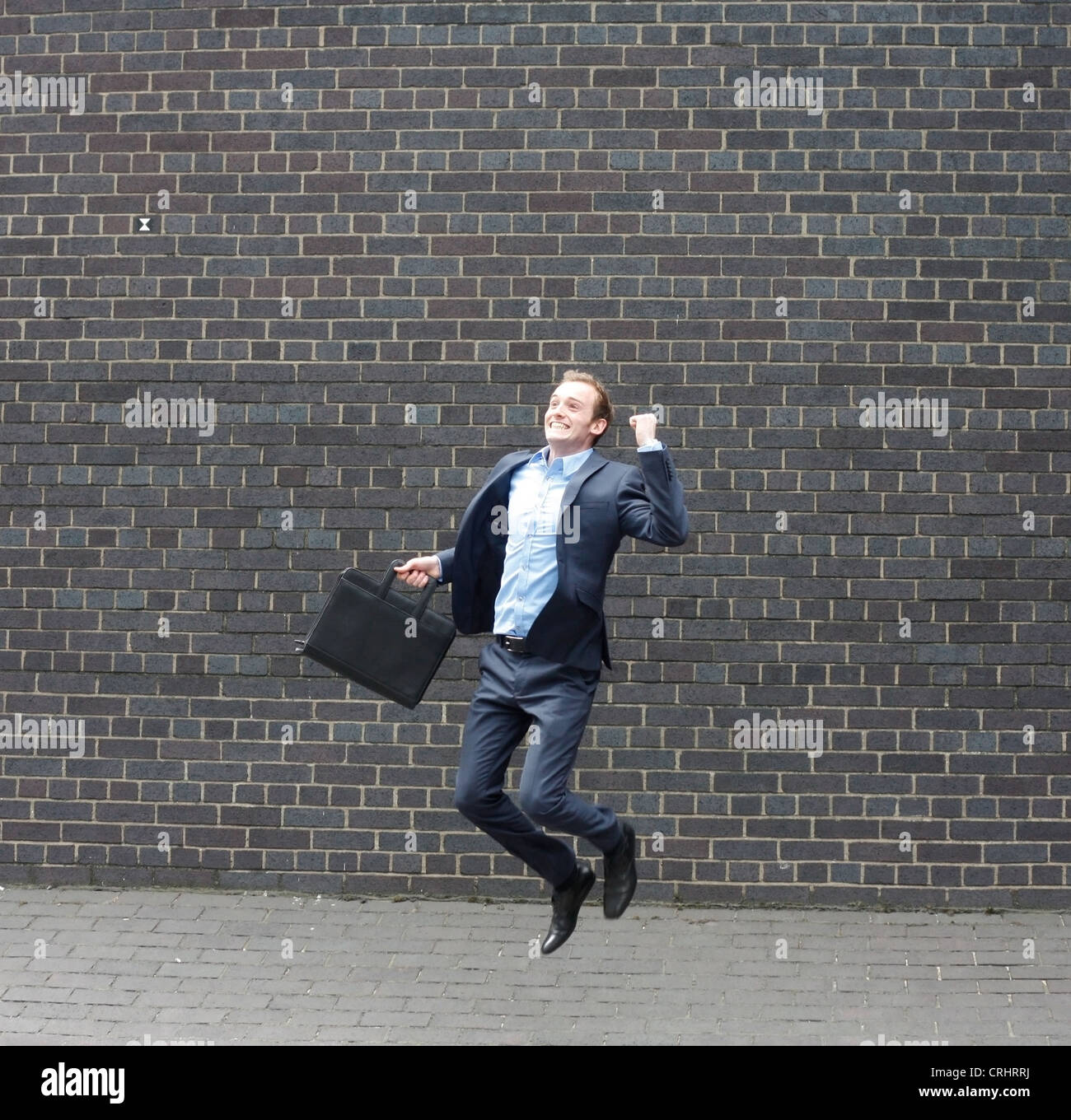 Business man jumping Stock Photo - Alamy