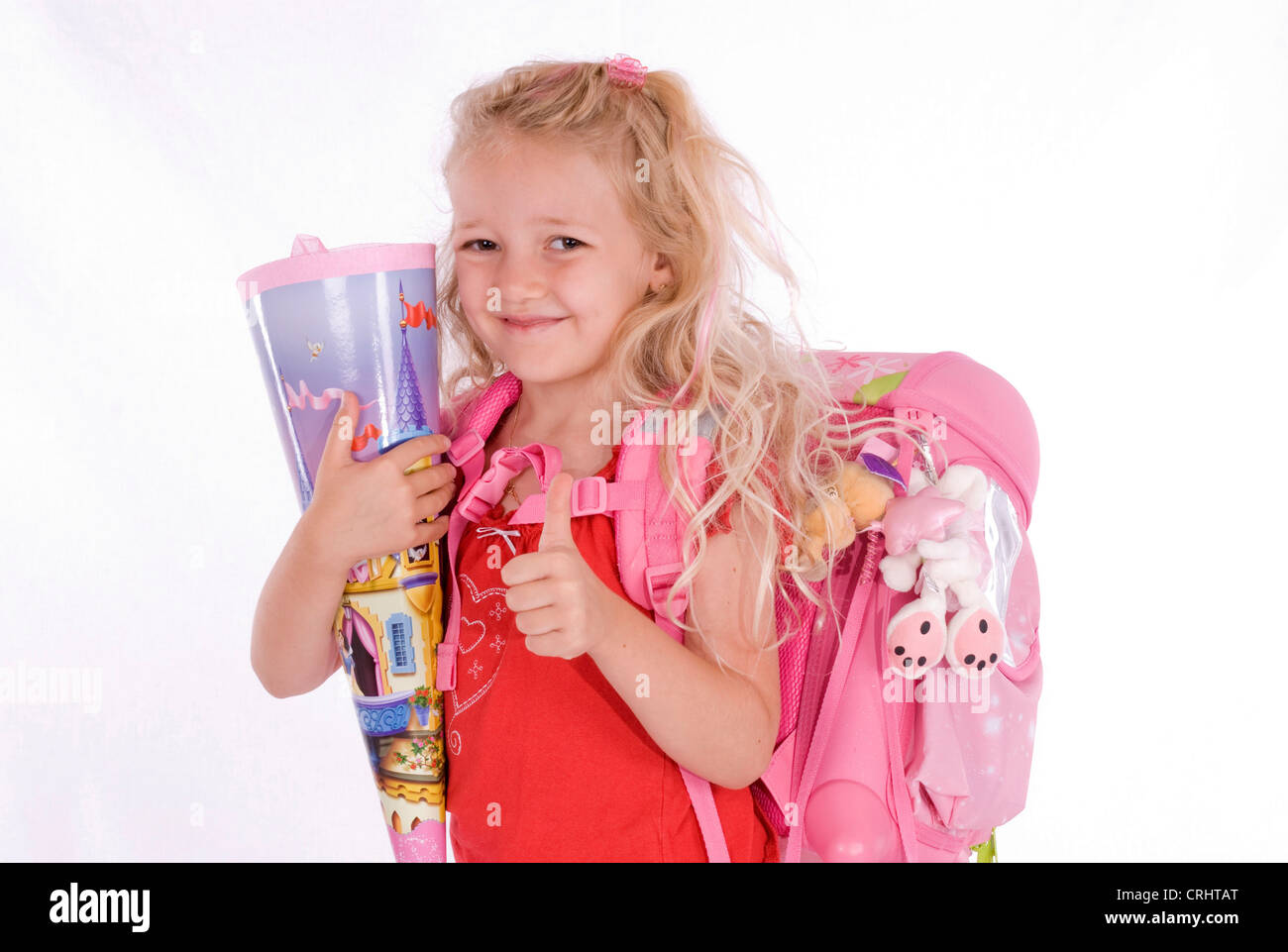 first grader with First-Day-of School-cornet is happy to go to school ...