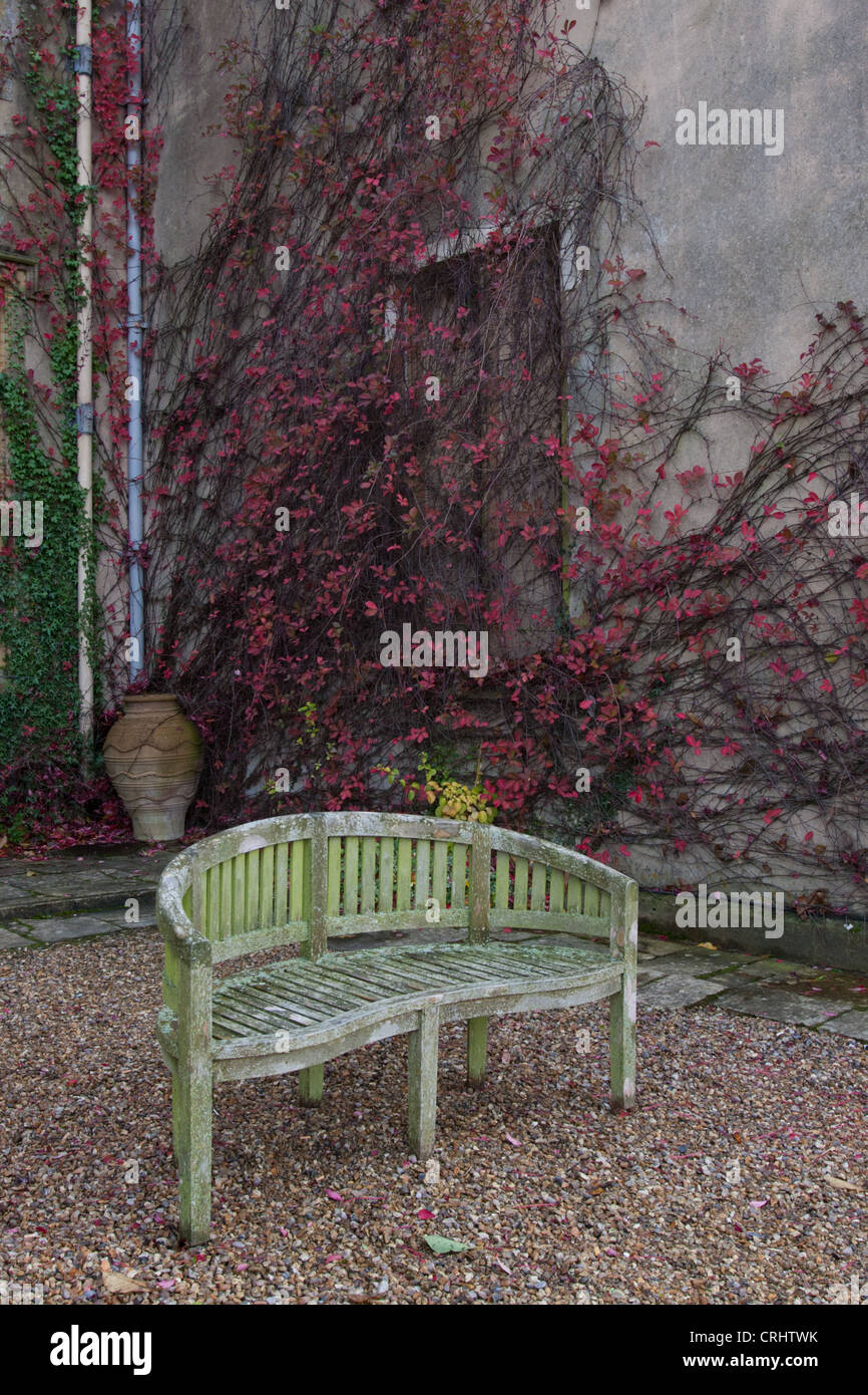 The exterior of a country house hotel showing the weather worn bench ...