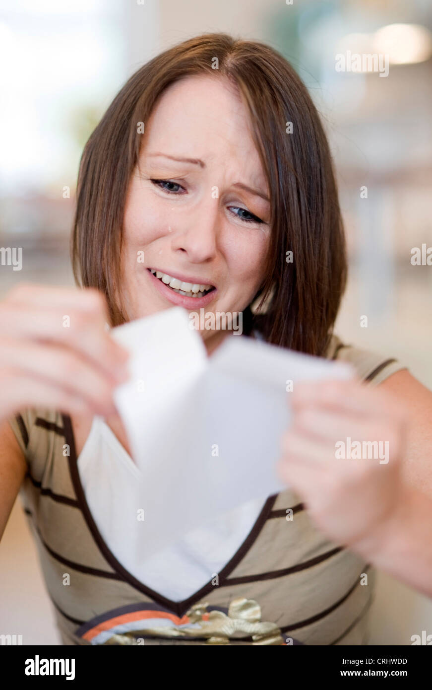 crying, young woman with picture in hand Stock Photo - Alamy