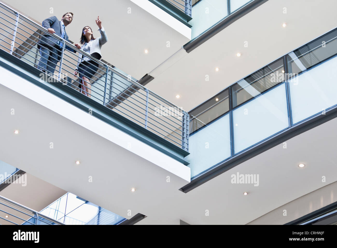 Business people talking on balcony Stock Photo - Alamy