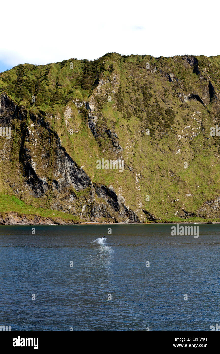 Zodiac crew approaching Inaccessible Island, South Atlantic Ocean Stock ...