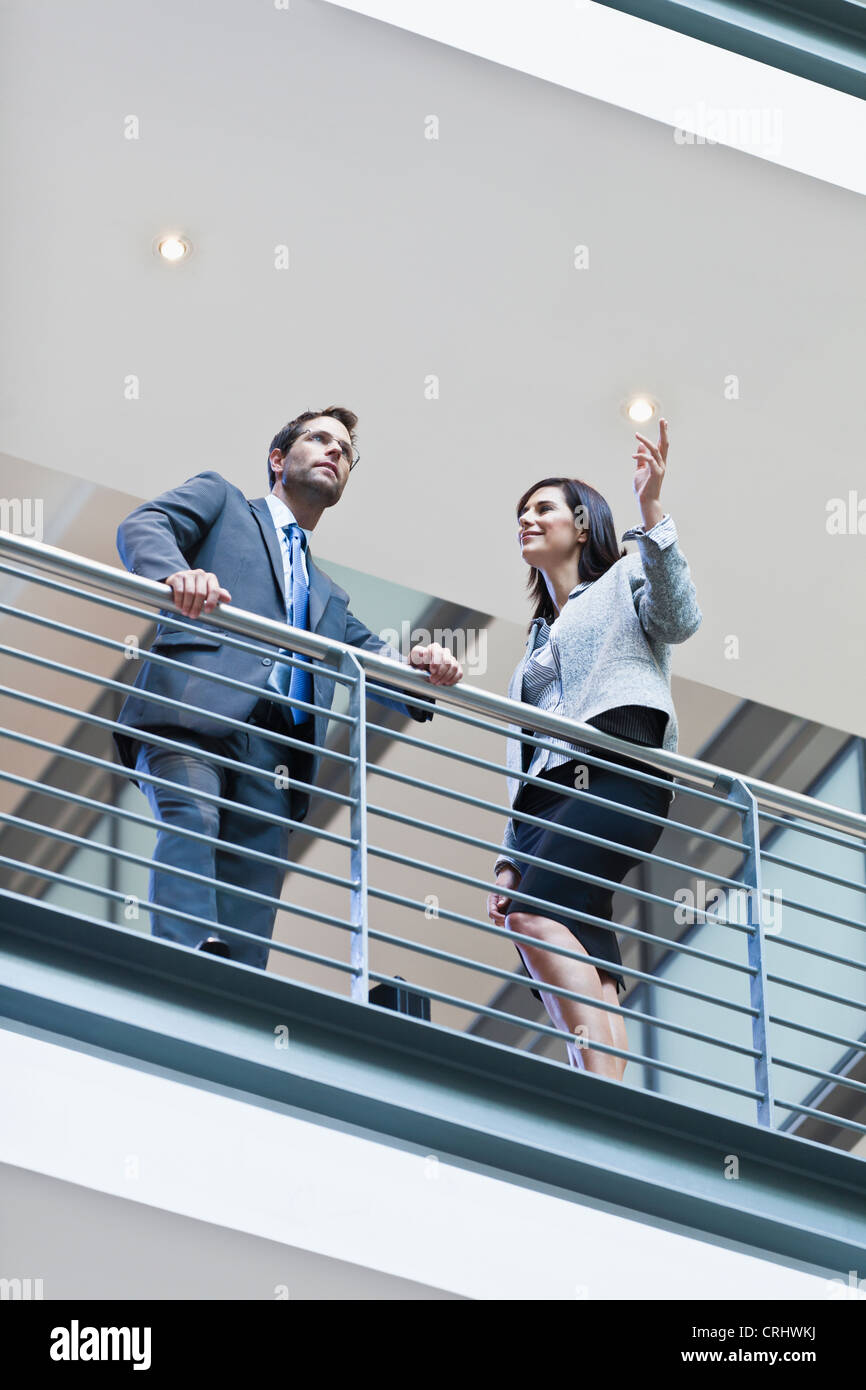 Business people talking on balcony Stock Photo - Alamy