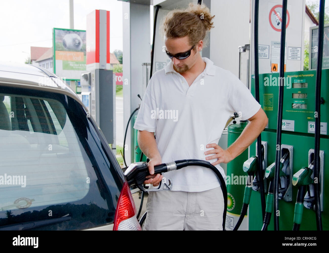 man at petrol station Stock Photo - Alamy